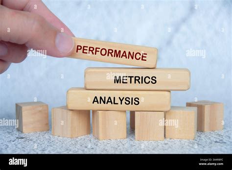 Performance Metrics Analysis Text On Wooden Blocks Strategic Business