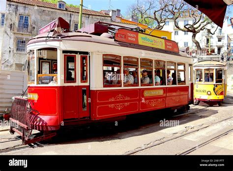 As A Result Of Heavy Motor Traffic Congestion In Lisbon Vintage Trams
