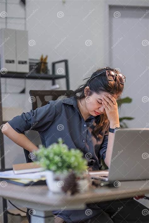 Asian Businesswoman Feeling Tired And Stressed Over An Unsuccessful