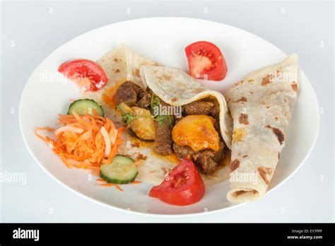 Studio Shot Traditional Indian Mutton Curry With Roti And Sambals Stock Studio Shot Traditional Indian Mutton Curry With Roti And Sambals Stock