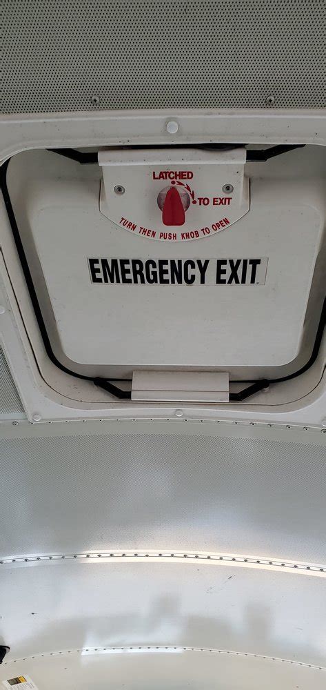 Emergency Exit Hatch Is Properly Labeled Is Not Cracked Or Broken
