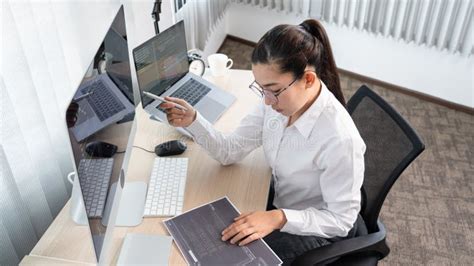 Young Asian Woman Programmer Typing Code Working With Computer At Table Coding Cyberspace And