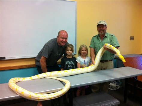 robb madison and amelia with bid daddy python at the reptile discovery
