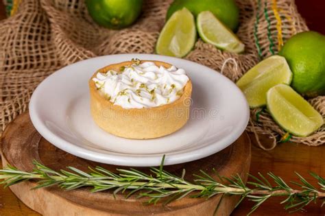 Mini Lemon Pie Topped With Whipped Cream And Lemons In The Background Stock Image Image Of