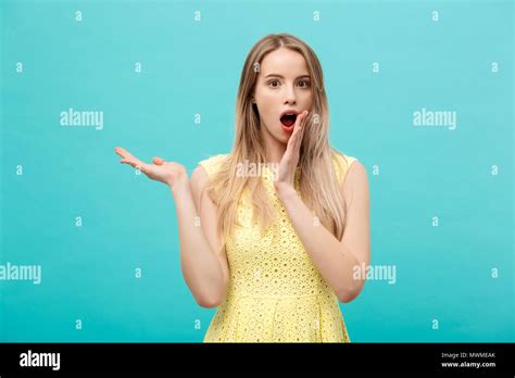 Woman Surprise Showing Product Beautiful Girl With Curly Hairstyle