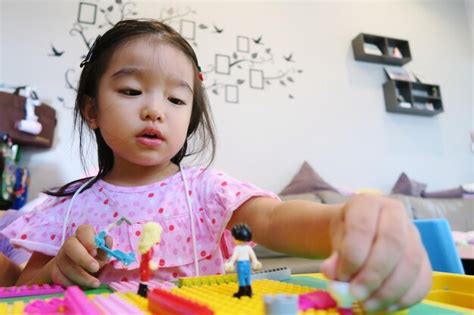 Premium Photo Portrait Of Cute Asian Girl Playing Lego