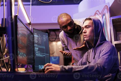 Hackers Discussing Cyberattack While Checking Spying Online And Using Malware On Computer Asian