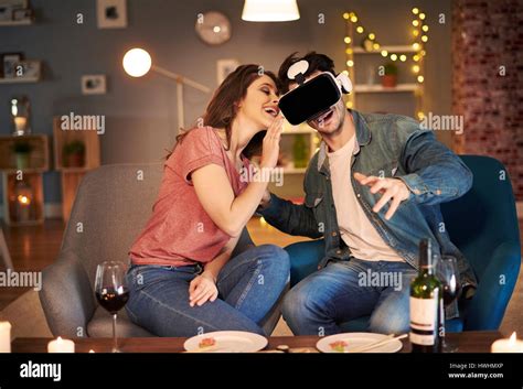 Woman Trying To See How The Headset Works Stock Photo Alamy