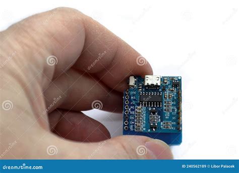 Hand Holding A Circuit Board With A Microchip Detail Of Microchips On An Electronic Circuit
