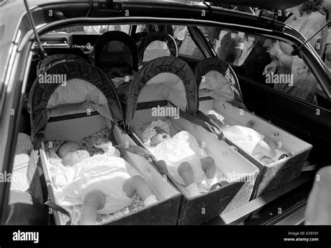 Three Of The Walton Sextuplets On Their Way To The Church Where They Will Be Christened Stock
