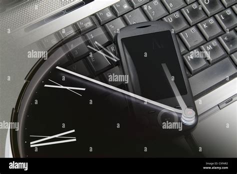 Clock With Laptop And Smart Phone Stock Photo Alamy