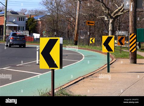 Left Chevron Arrow Traffic Signs Warn Drivers Of A Sudden Curve In The