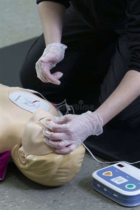 First Response Worker Demonstrates Cpr And Proper Defibrillator