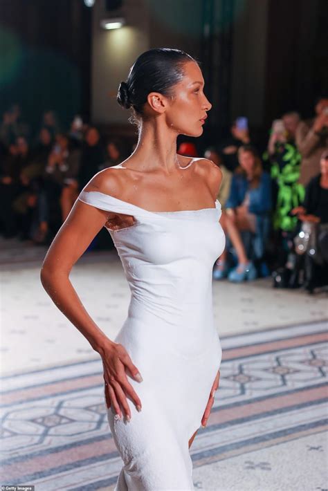 Bella Hadid Takes To The Runway Nude Before Her Dress Is Sprayed On In