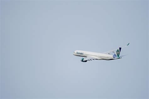 Premium Photo A Regular Airline Passenger Plane Heading To Its