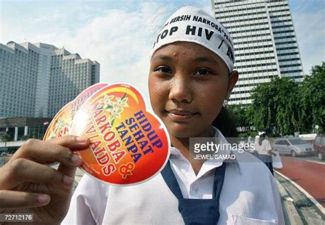 A Schoolgirl Displays Leaflets During A Demonstration In Awareness