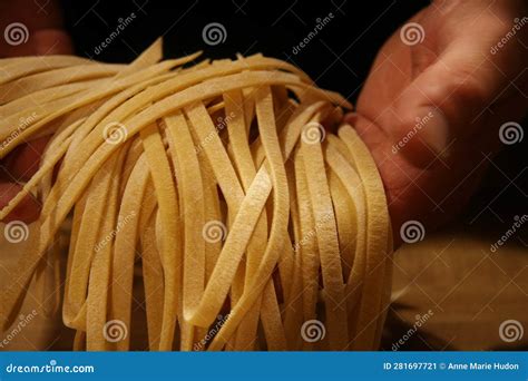 Handmade Pasta Drying In Hands Italian Fresh Fettuccine Traditional