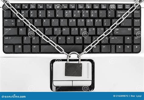 Padlock With Chain On The Laptop Keyboard Cyber Safety And Computer Security Concept Stock