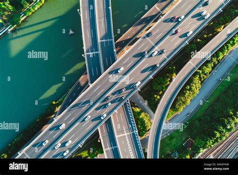 Aerial Of Vehicles Navigate A Complex Highway System Showcasing
