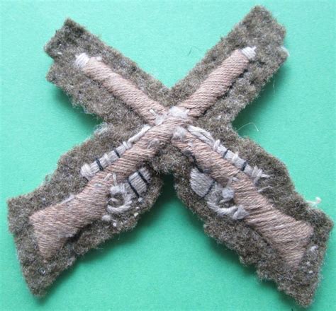 Crossed Rifles Badge