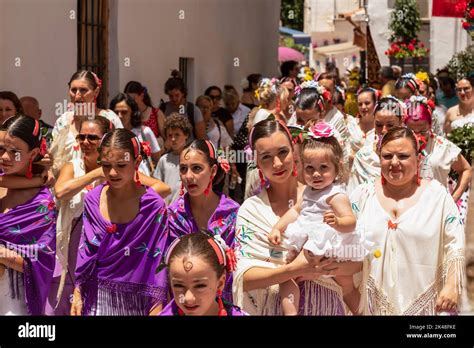 Procession Of Spanish Women And Girls In Traditional Dress During