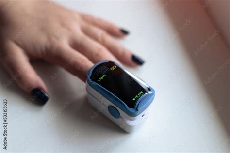 Pulse Oximeter On A Woman S Hand Pulse Oximeter With Blank Display For Your Text A Woman Is
