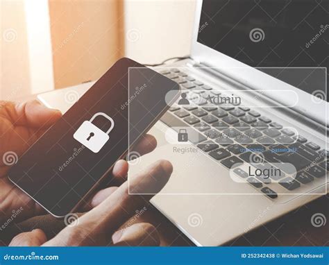 A Male Hacker Used His Phone To Unlock A Password To Hack Information From A Laptop Computer