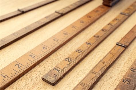 Premium Photo Group Of Old Wooden Ruler On Table Measuring Or Accuracy Concept Close Up