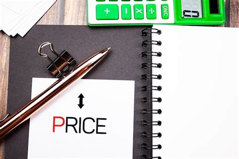Premium Photo Price Concept Text On Notepad With Regulator Arrow Business Concept