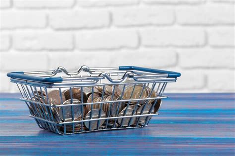 Premium Photo Money Coin In Mini Shopping Cart Or Trolley