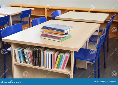 School Desk With Books And Chairs In The Classroom Education Concept