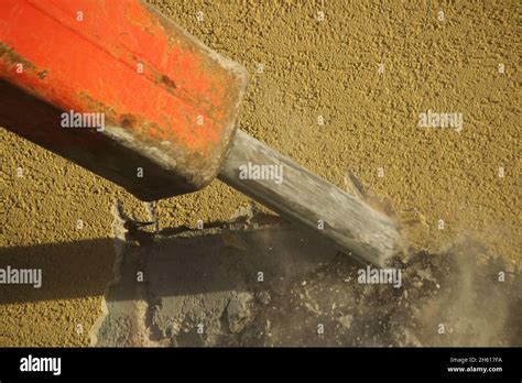 Demolition Of A House Wall With A Large Chisel Stock Photo Alamy