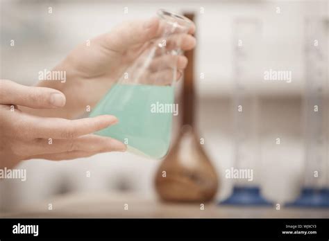 Hand Of Laboratory Technician Holding Flask With Chemical Stock Photo Alamy