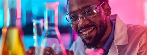 Smiling Chemical Engineer Conducting Laboratory Experiments With