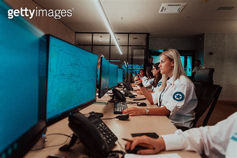 Group Of Female Security Operators Working In A Data System Control