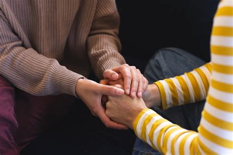 Premium Photo Midsection Of Biracial Lesbian Couple Holding Hands