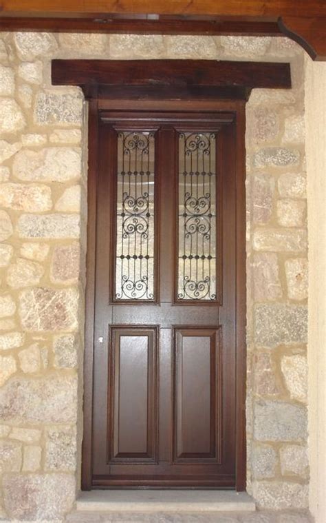 Ξύλινη πόρτα εισόδου Άρτιον Ξύλινα Κουφώματα