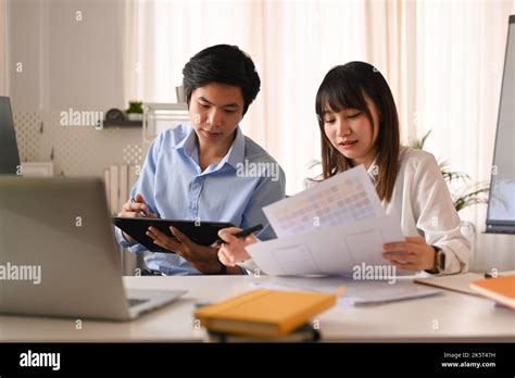 Team Of Web Designers Collaborating And Developing Template Layout For Mobile Application In