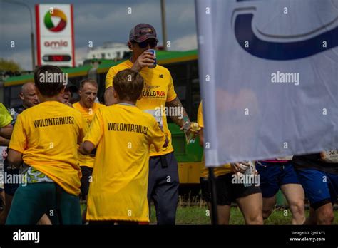 The Participants Of The 2022 Wings For Life World Run In Poznan Poland Drinking Water While