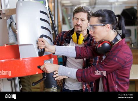 Man And Woman With Machine Cnc In Factory Stock Photo Alamy