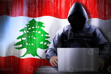 anonymous hooded hacker and flag of lebanon binary code cyber attack