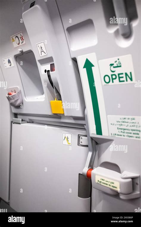 An Emergency Door In The Aircraft Cabin Passenger Airplane Entrance Door The Inflatable