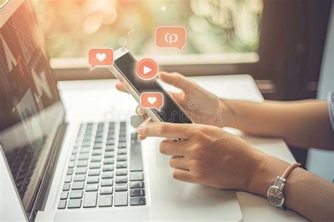 A Person Is Multitasking With A Laptop And Cell Phone In An Office Setting Stock Illustration