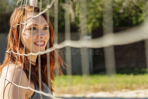 A Gorgeous Redhead Fitness Model Preparing To Play Volleyball Stock Image Image Of Fashion