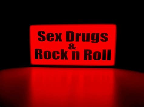 Enseigne Publicitaire 1 Amsterdam Allume Le Panneau Lumineux Sex Drugs And Rock N Roll Aux