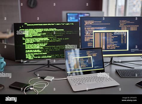 Background Image Of Computers And Laptops With Green Code Lines On