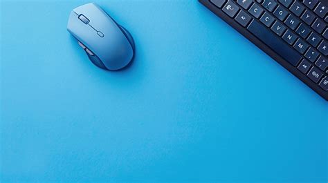 top view of computer mouse and keyboard on blue background desk keyboard mouse background
