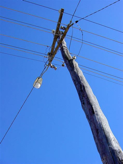 Utility pole supporting power lines against blue sky Free Stock Photo ...