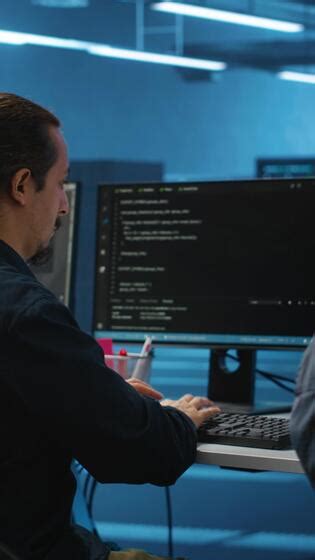 Vertical Multiracial Coworkers In Data Center Coding And Checking