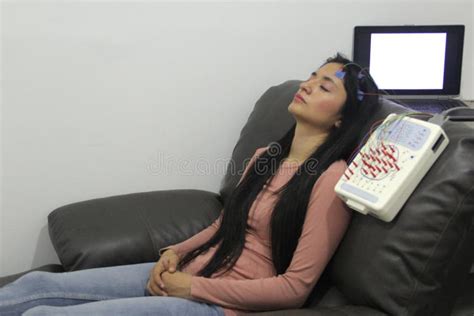 Electroencephalogram On A 20 Year Old Woman To Measure Brain Electrical Activity And Diagnose